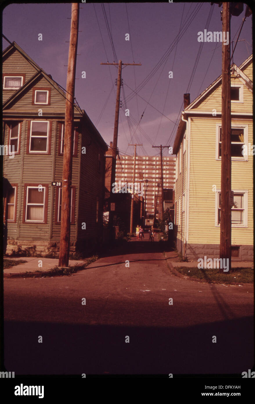 A metropolitan housing building is located at the end of an alley ...
