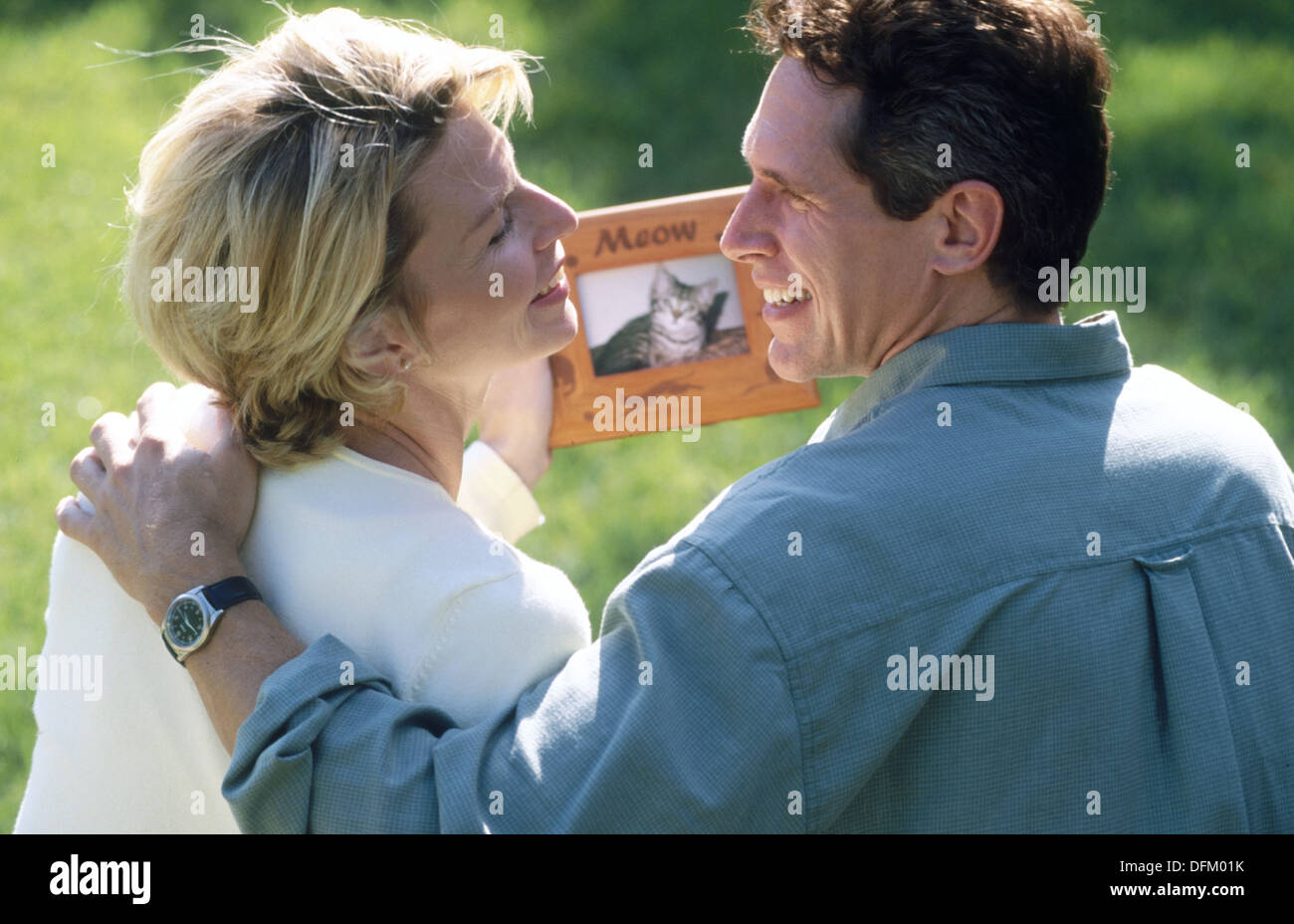 Woman admiring picture of her man hi-res stock photography and images ...