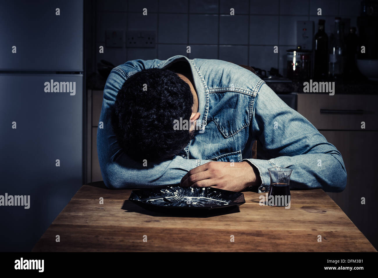 Man sitting alone at dinner table hi-res stock photography and images ...