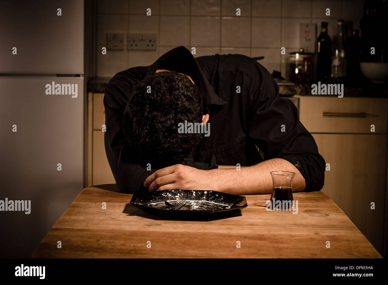 Man sitting alone at dinner table hi-res stock photography and images ...