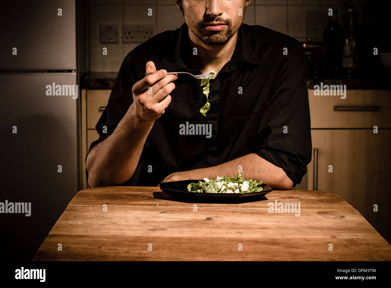 Man eating dinner home hi-res stock photography and images - Alamy