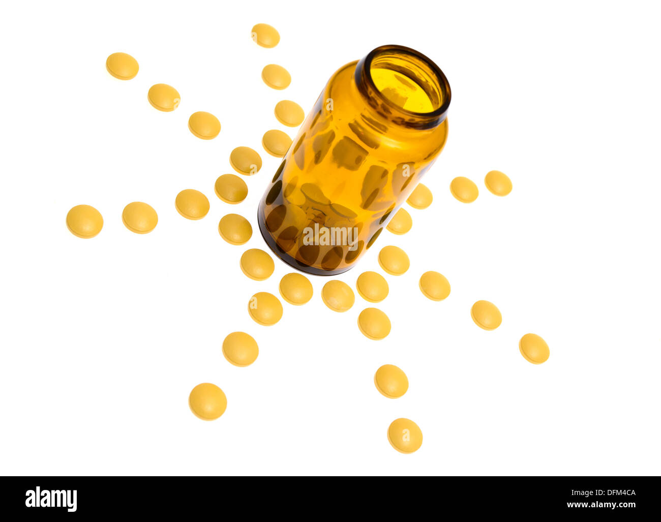Pills spilling out of pill bottle isolated on white Stock Photo - Alamy