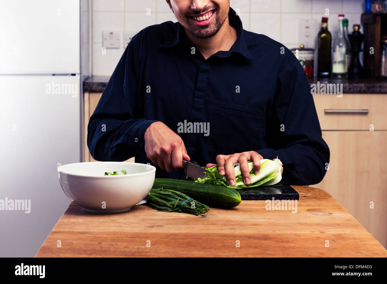 Man making a salad Stock Photo - Alamy