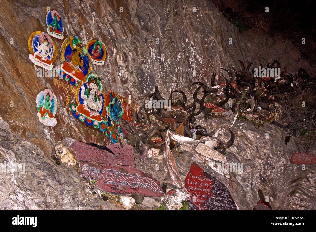 Mani rock wall with paintings and Yak horns below Potala Palace, Lhasa ...