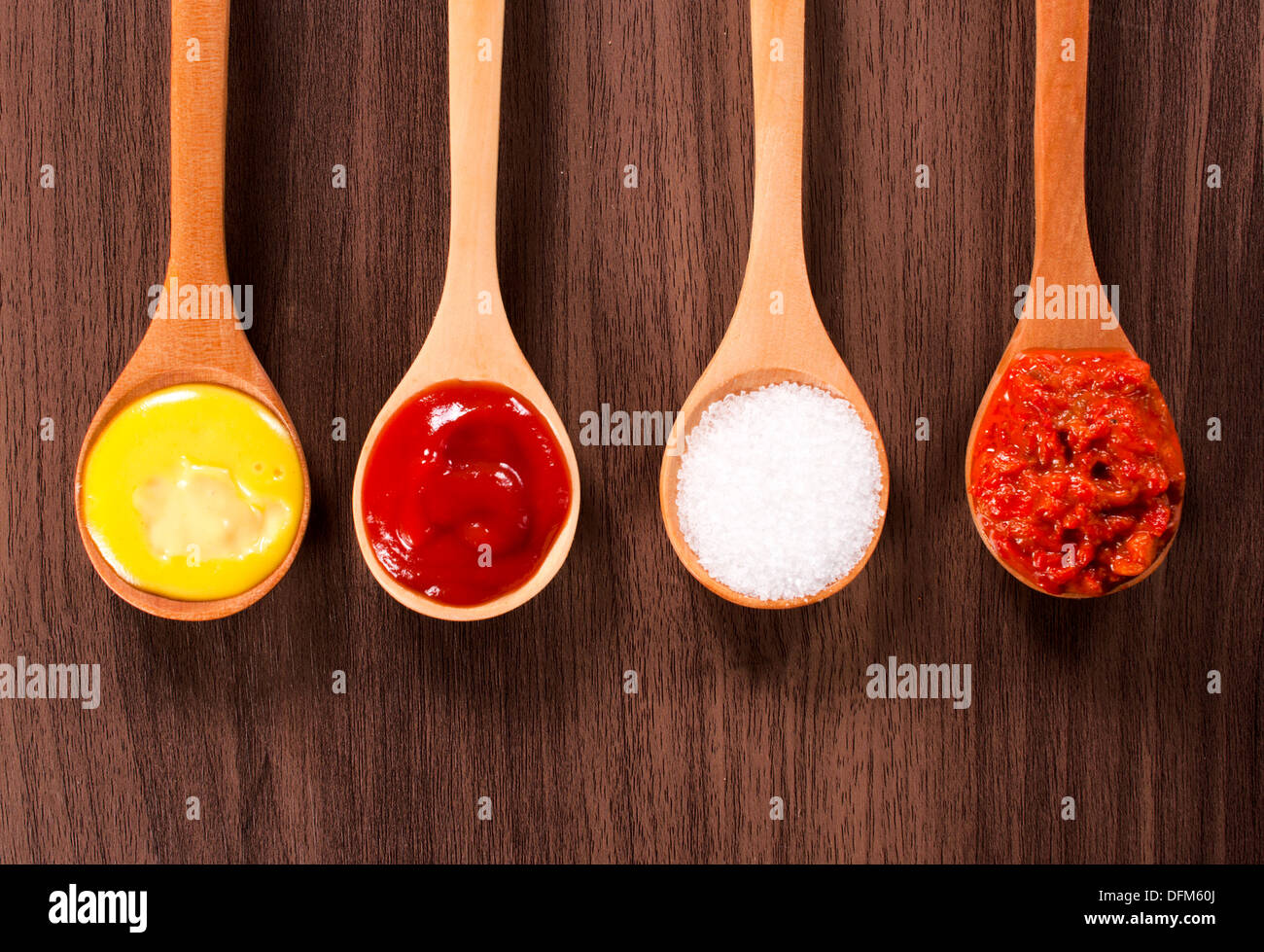 Food ingredients in the wooden ladles from above Stock Photo - Alamy