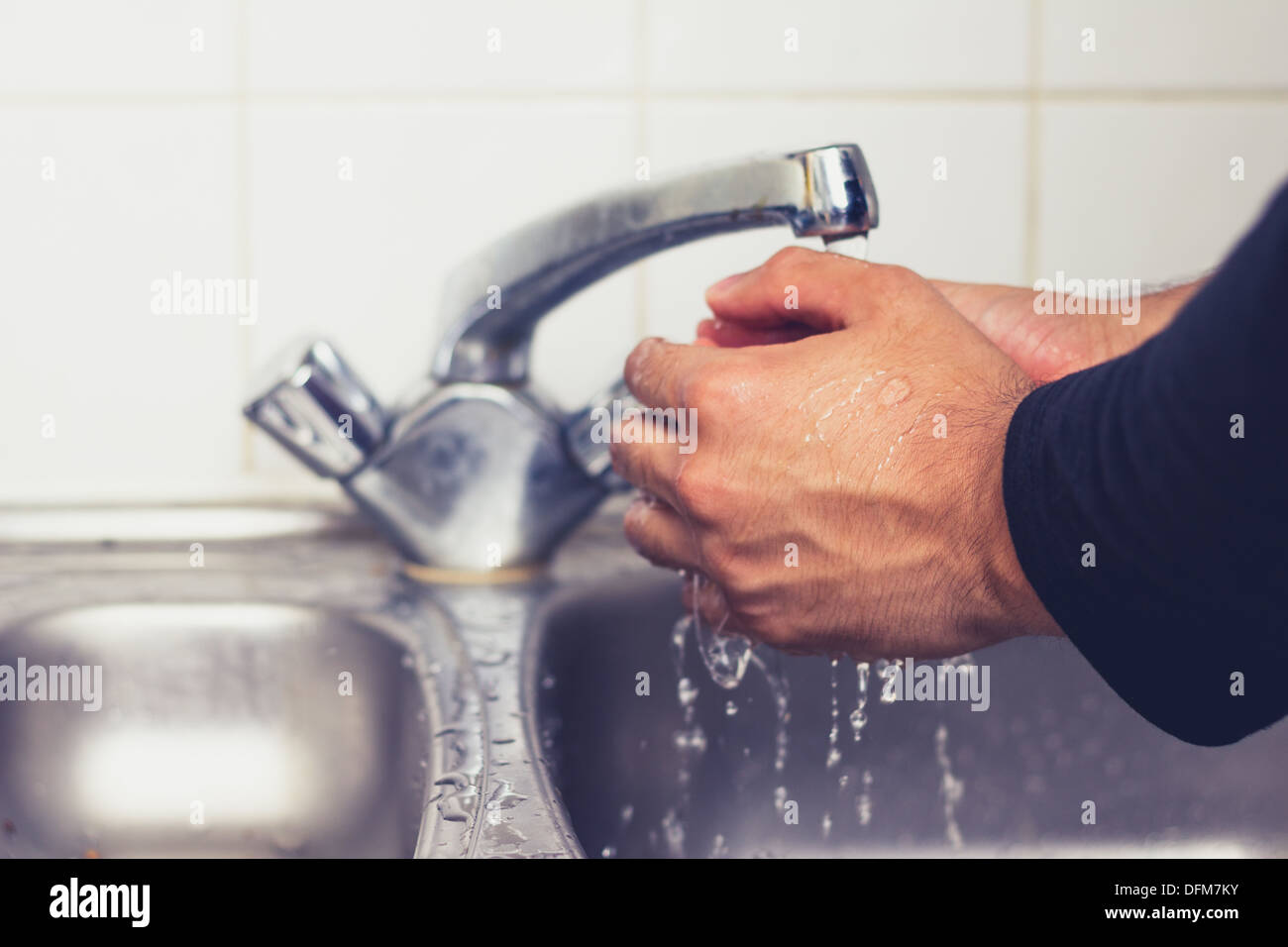 Young man washing hands hi-res stock photography and images - Alamy
