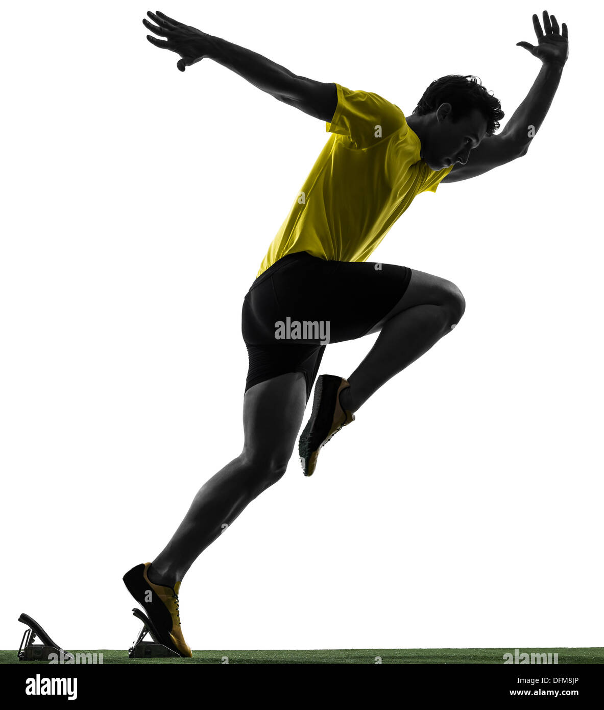 one man young sprinter runner in starting blocks silhouette studio on ...