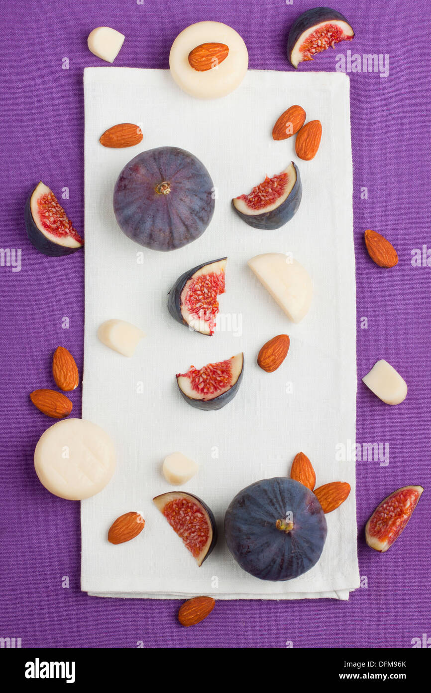 Fresh ripe figs with cheese and almonds shot from above Stock Photo - Alamy