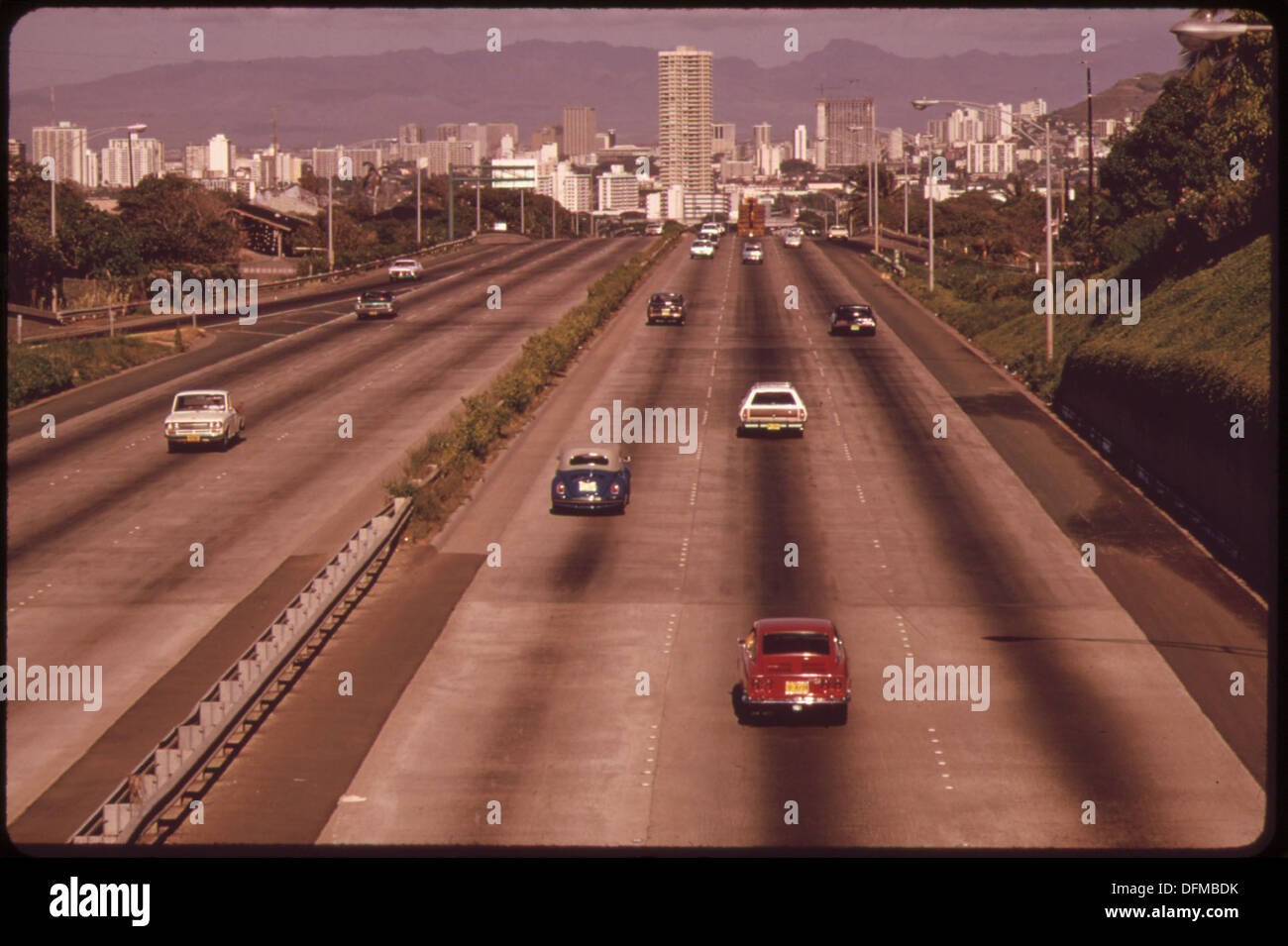 This photograph captures the view of downtown Honolulu from the H-1 ...