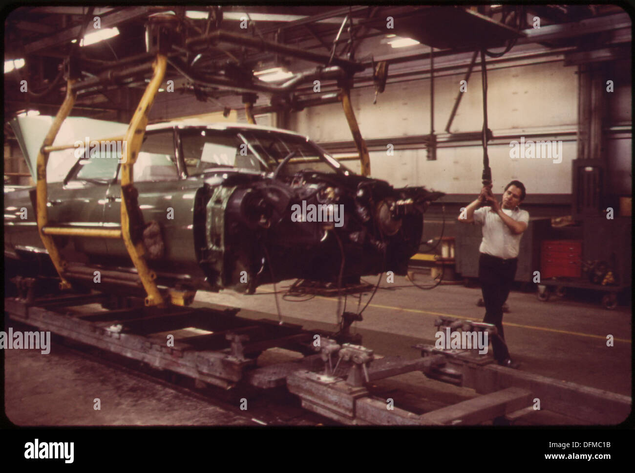 This image shows a completed car body on the Cadillac assembly line ...