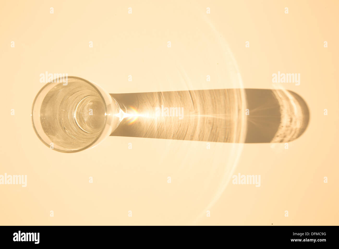 Caustic effect as light passes through a glass of water Stock Photo - Alamy