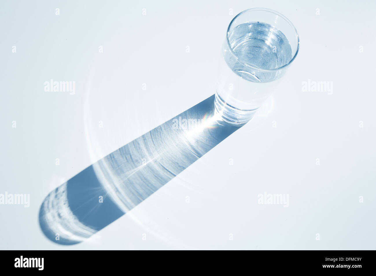 Caustic effect as light passes through a glass of water Stock Photo - Alamy