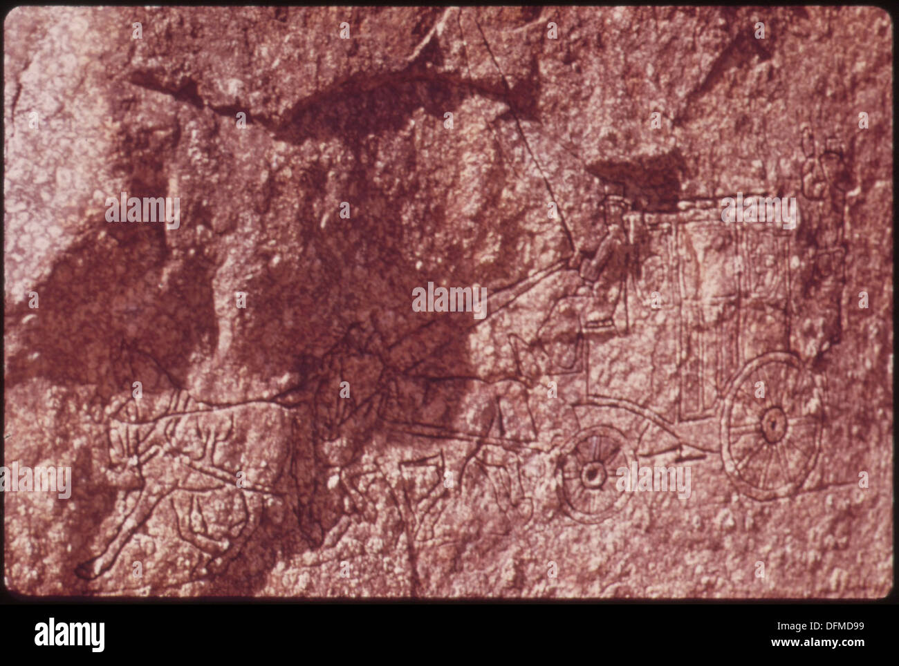 The outline of an old stagecoach is hand-carved into the rock along ...