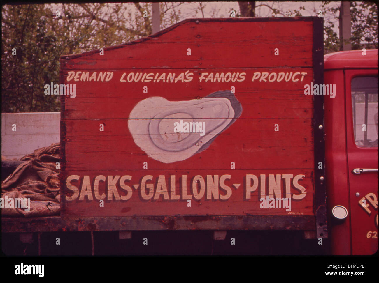 A historical photograph showing an oyster delivery truck, reflecting ...