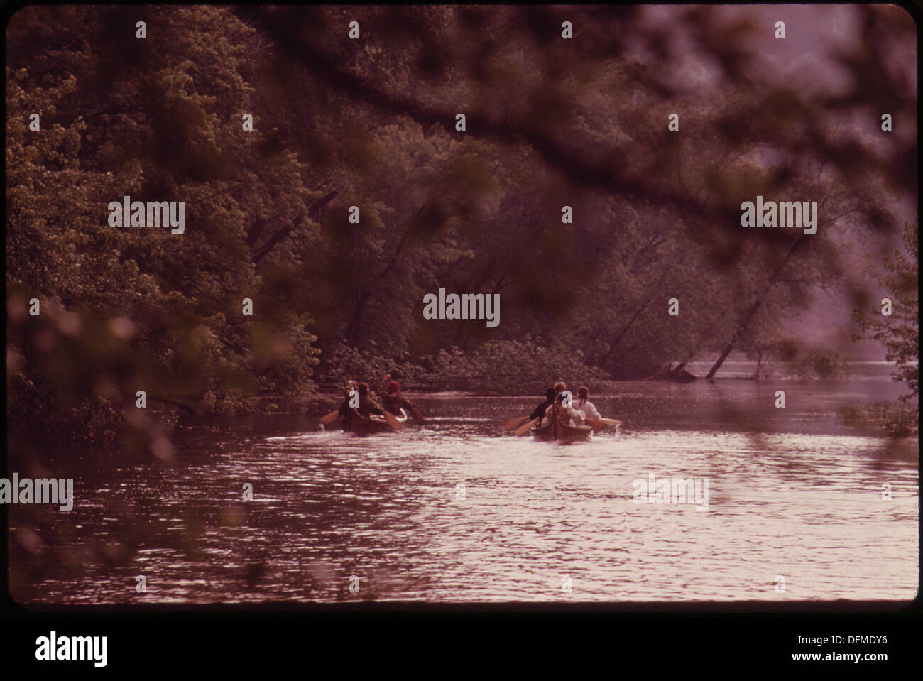 This photo shows two canoes and seven men retracing a 3,000-mile ...