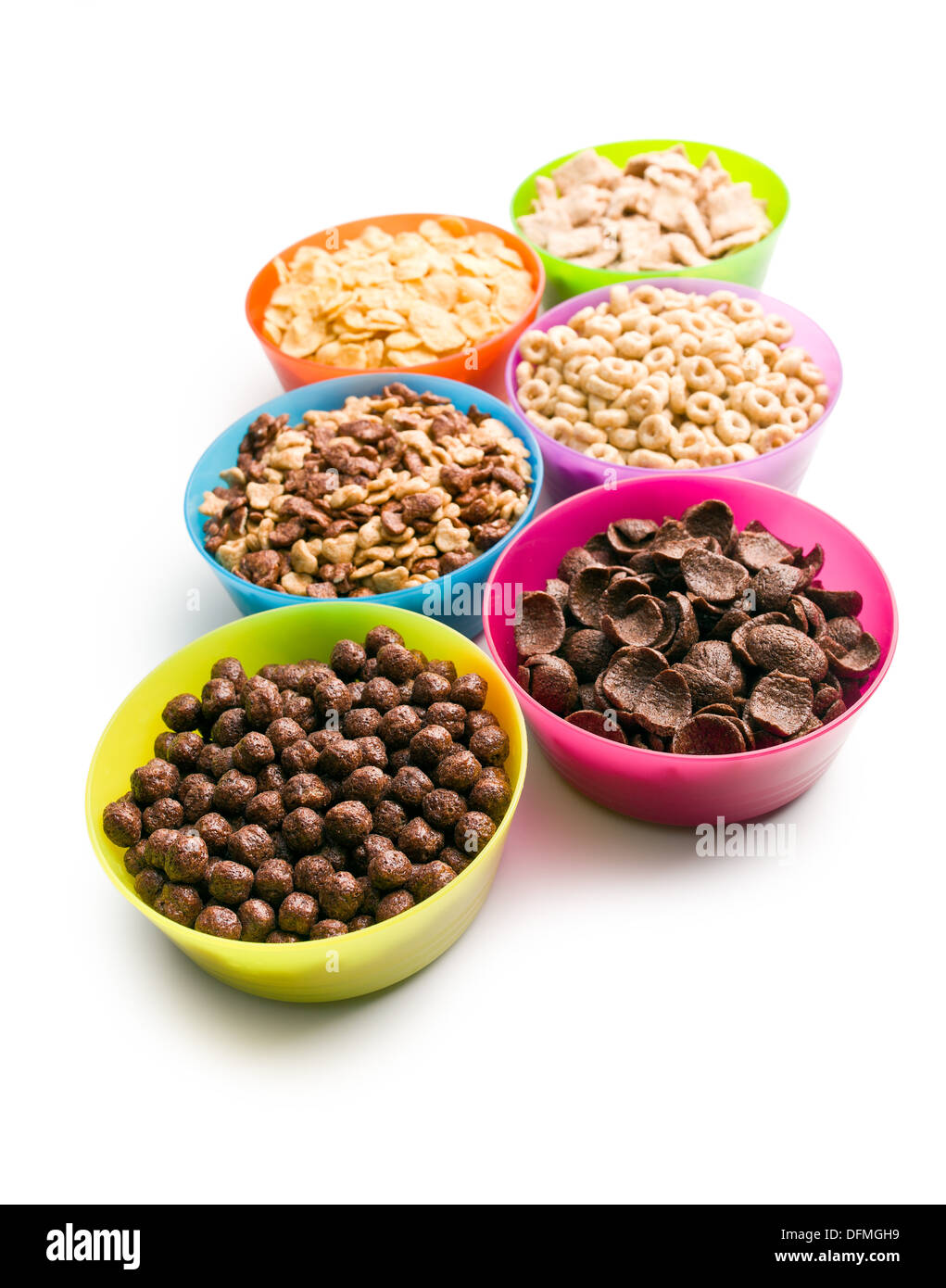 various kids cereals in plastic bowls on white background Stock Photo ...