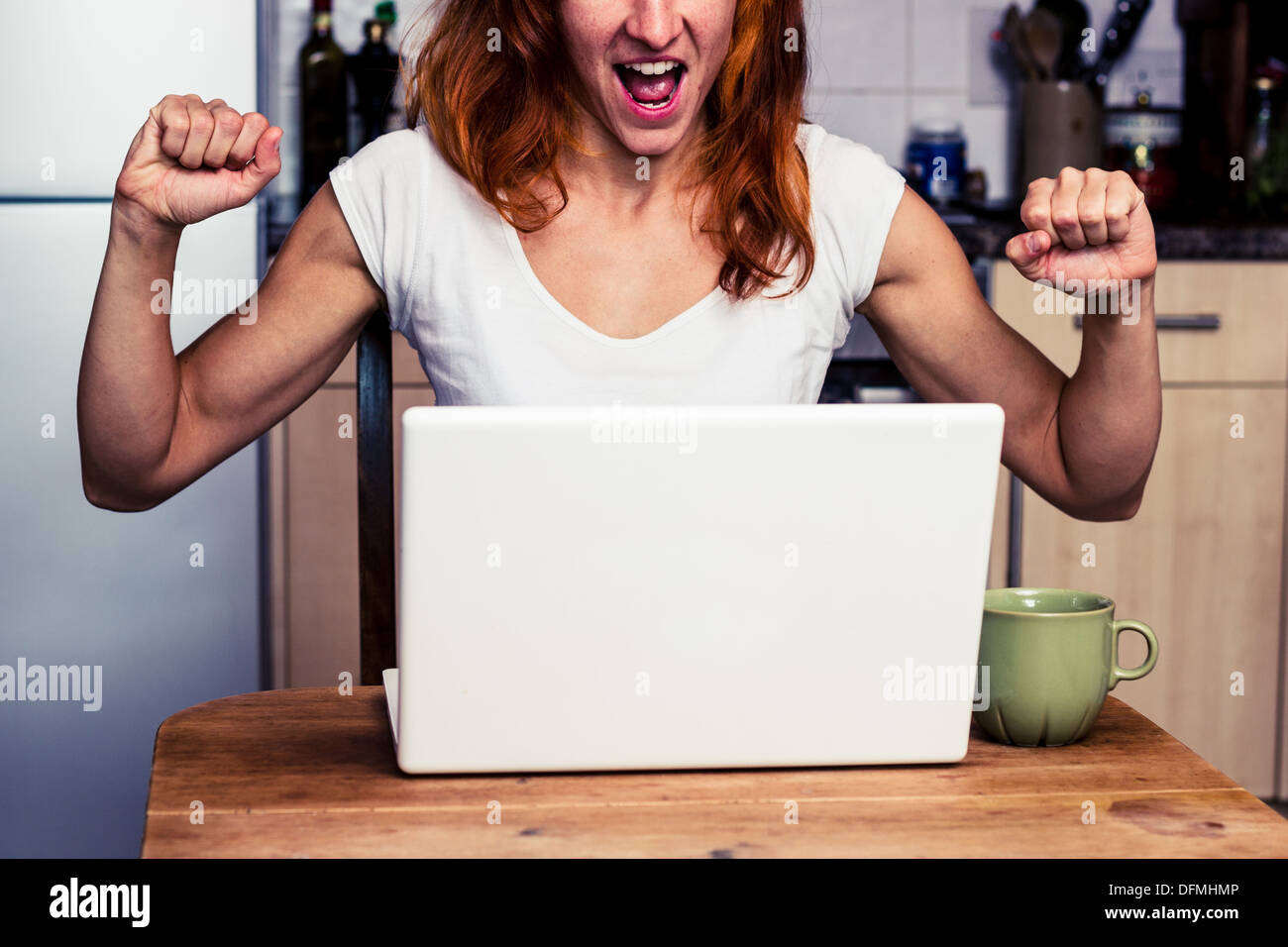Excited woman computer home hi-res stock photography and images - Alamy