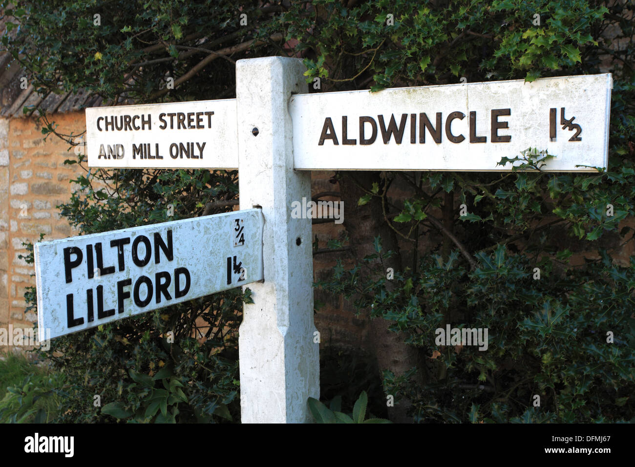 White Wooden directional road sign Duddington village, Northamptonshire ...