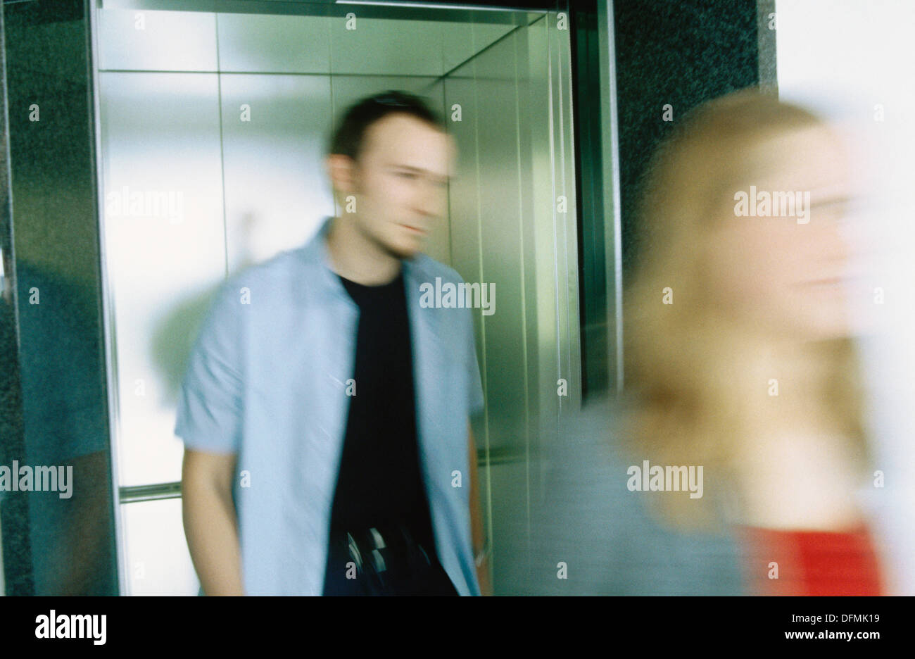 Woman exit elevator hi-res stock photography and images - Alamy