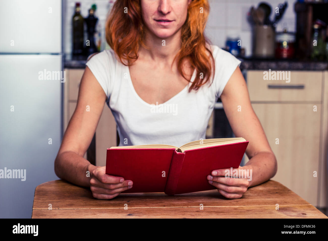 Beautiful woman red hair reading hi-res stock photography and images ...