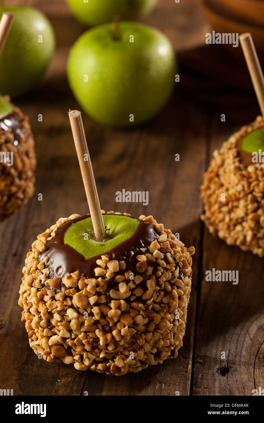 Homemade Caramel Taffy Apple with Peanuts for Halloween Stock Photo - Alamy