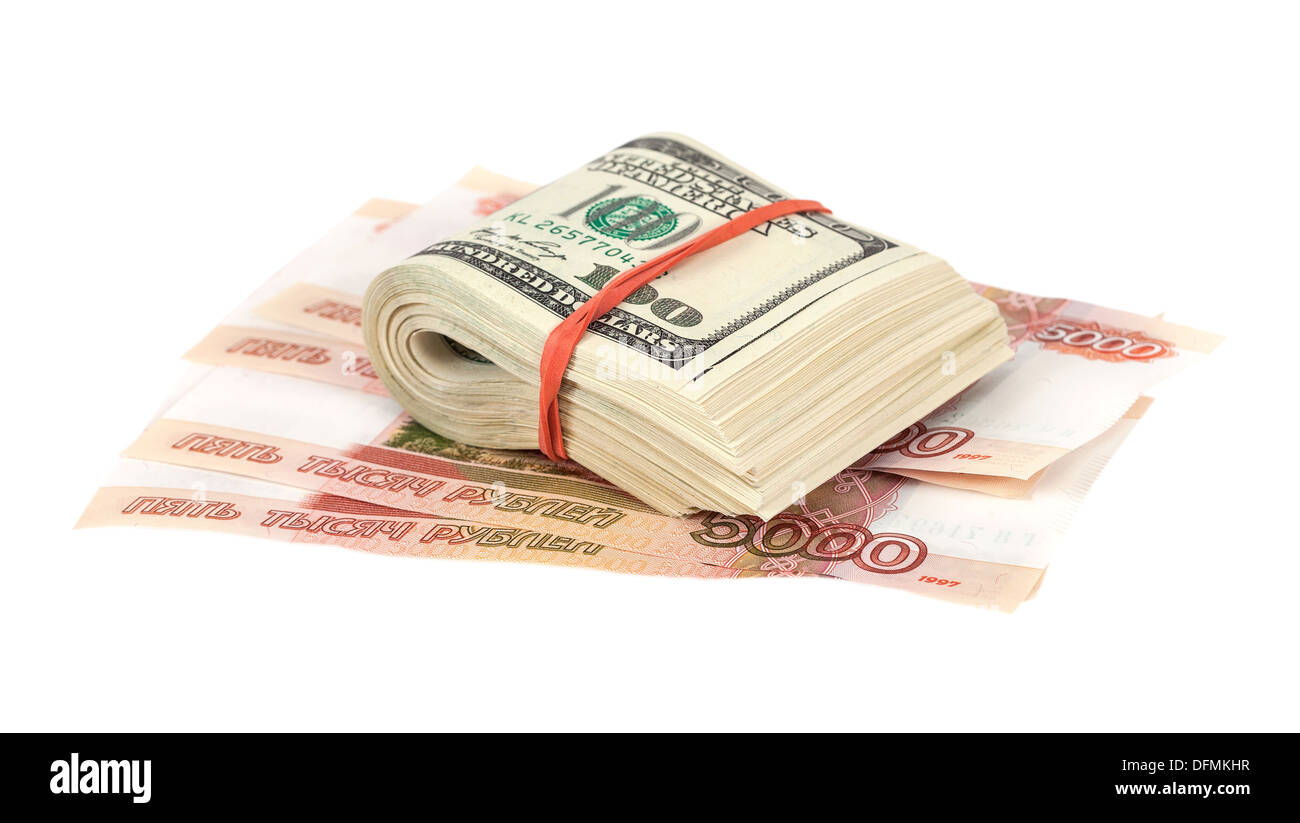 Folded dollar bills laying over rouble background Stock Photo - Alamy