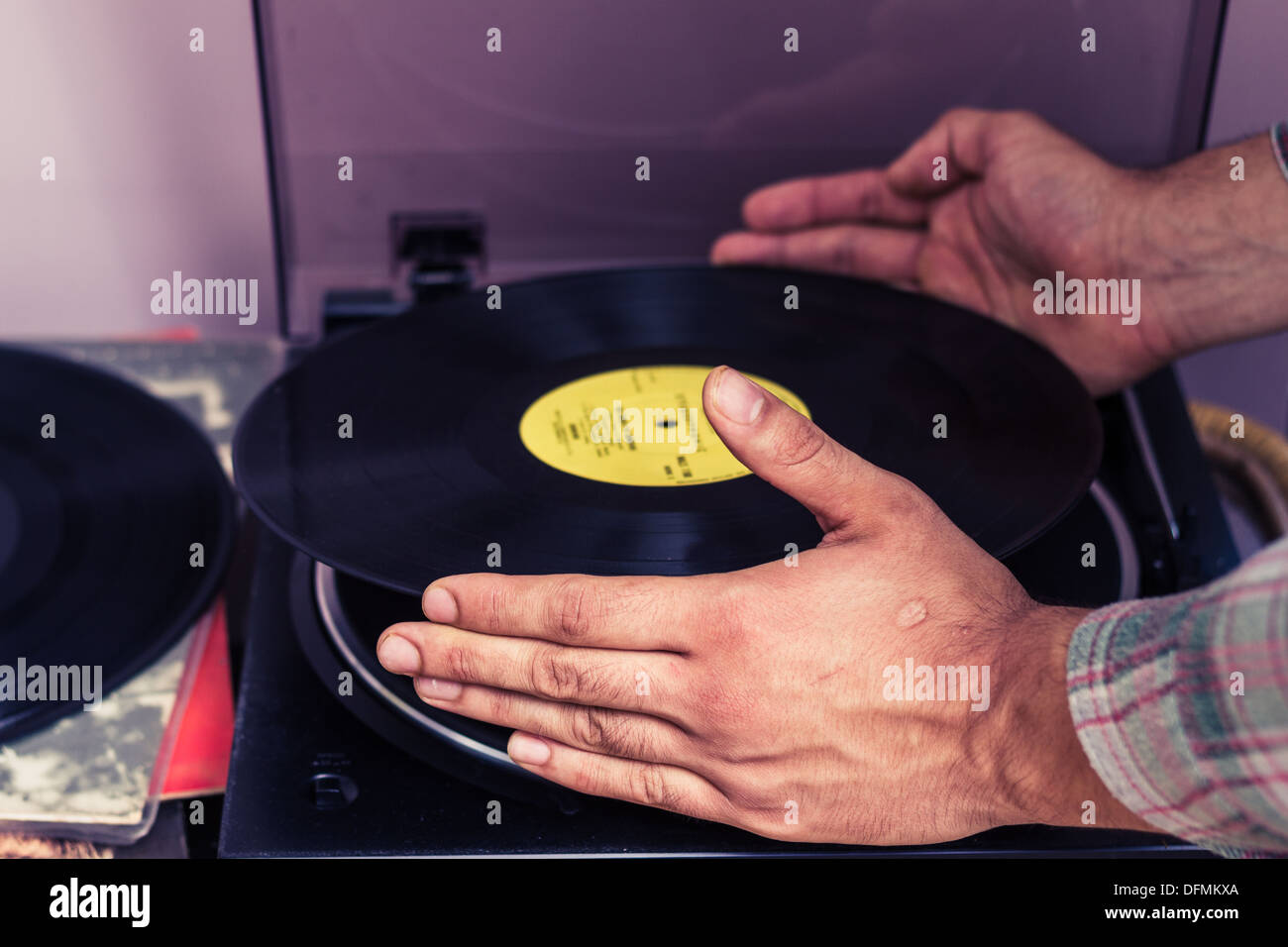 Male hands place record on turntable Stock Photo - Alamy