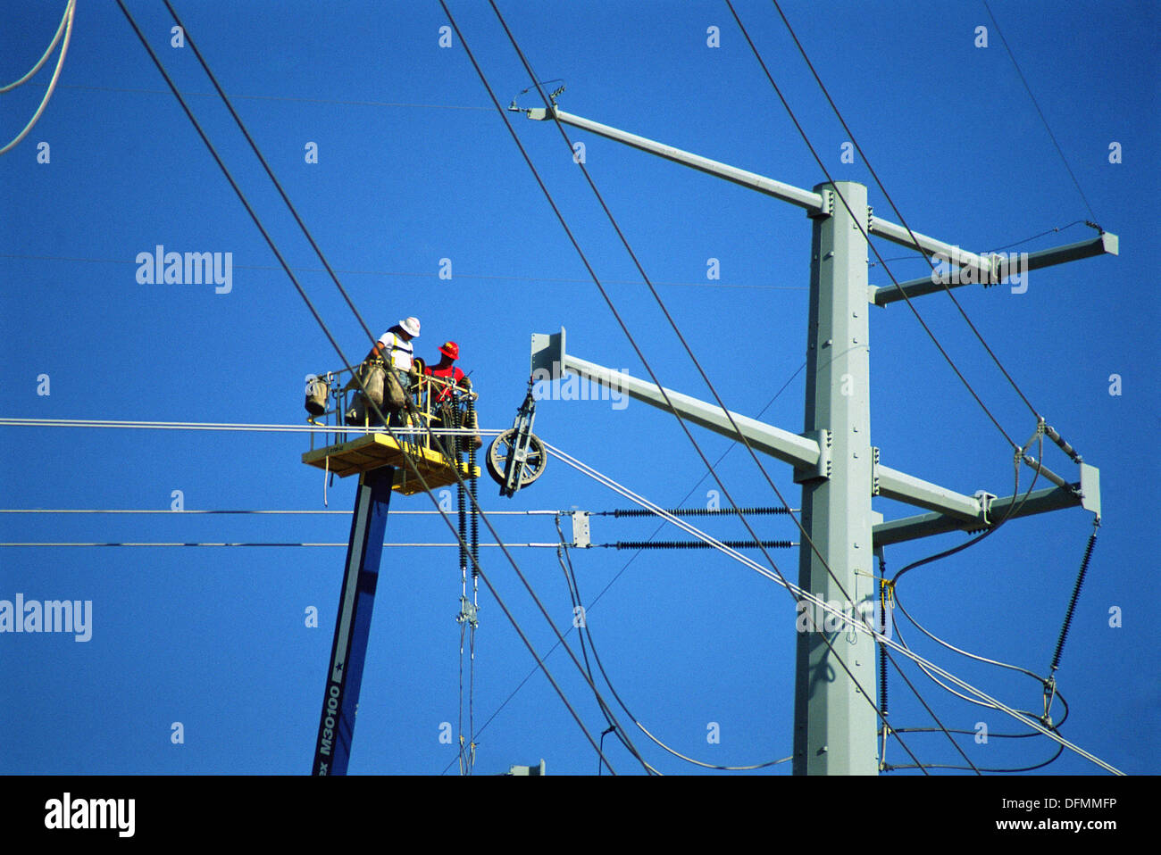 Workers installing power lines Stock Photo - Alamy