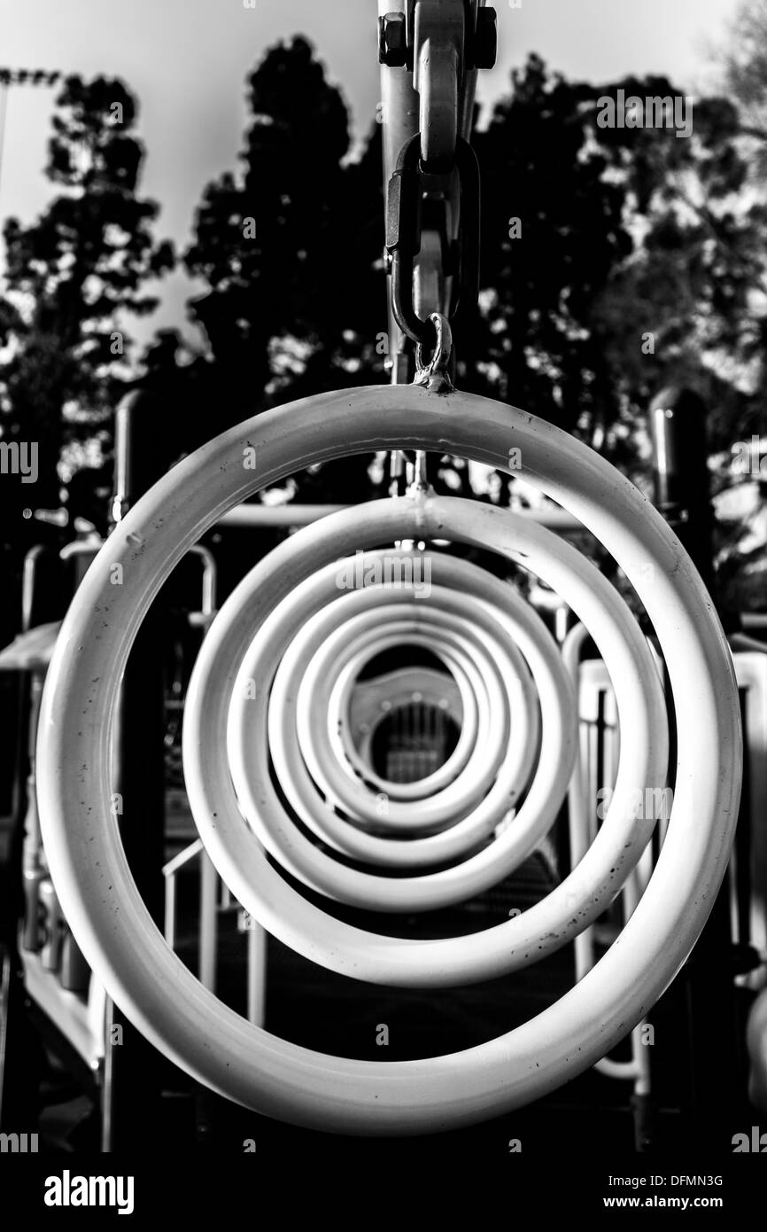 A row of monkey bar hanging rings at a children's playground Stock ...