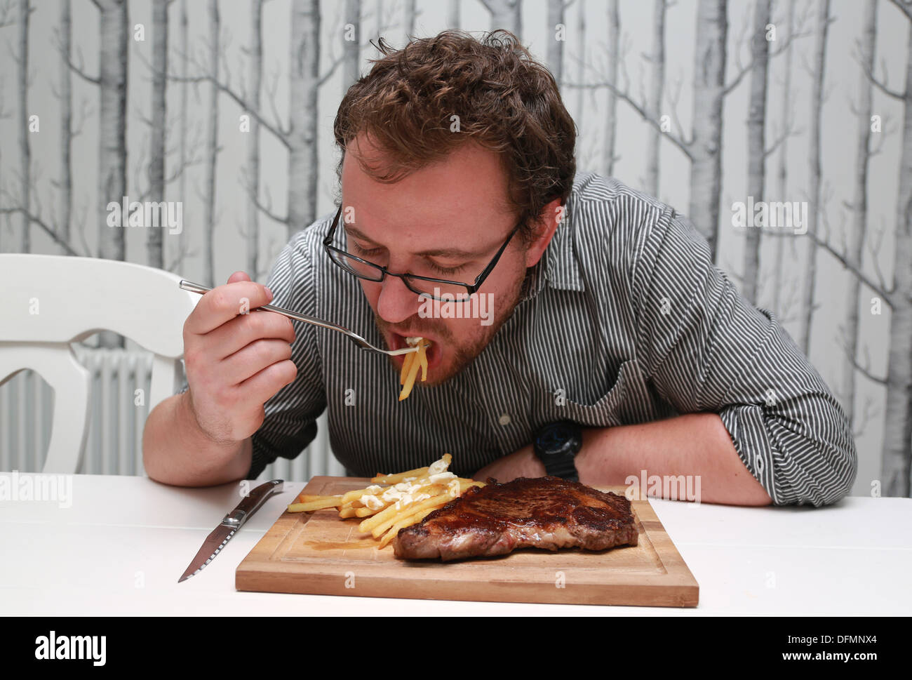 Man eating large juicy steak hi-res stock photography and images - Alamy