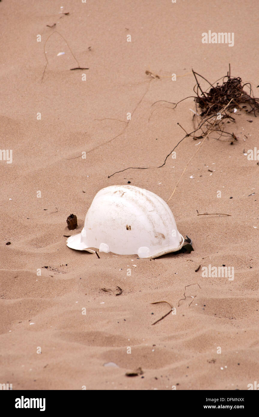 White construction hard hat on sand Stock Photo - Alamy