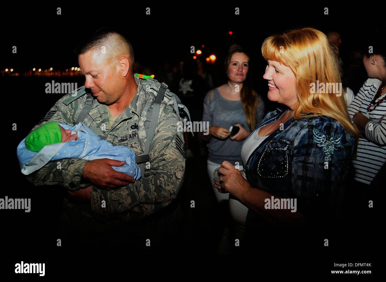 U.S. Air Force Tech. Sgt. David Dane holds his 6-day-old son Tristan ...