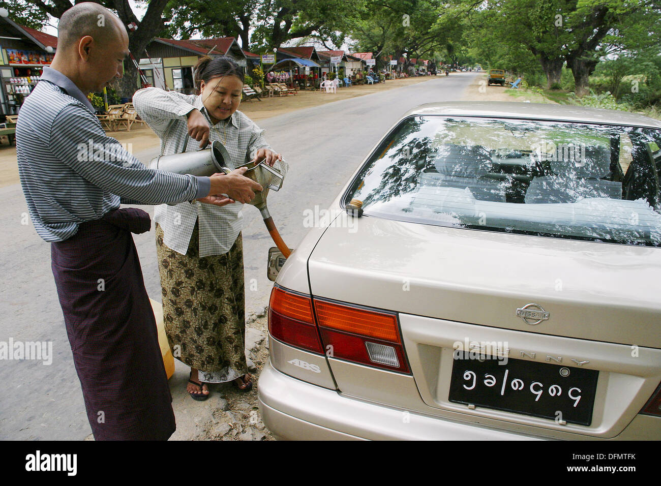 Two woman gas filling station hi-res stock photography and images - Alamy