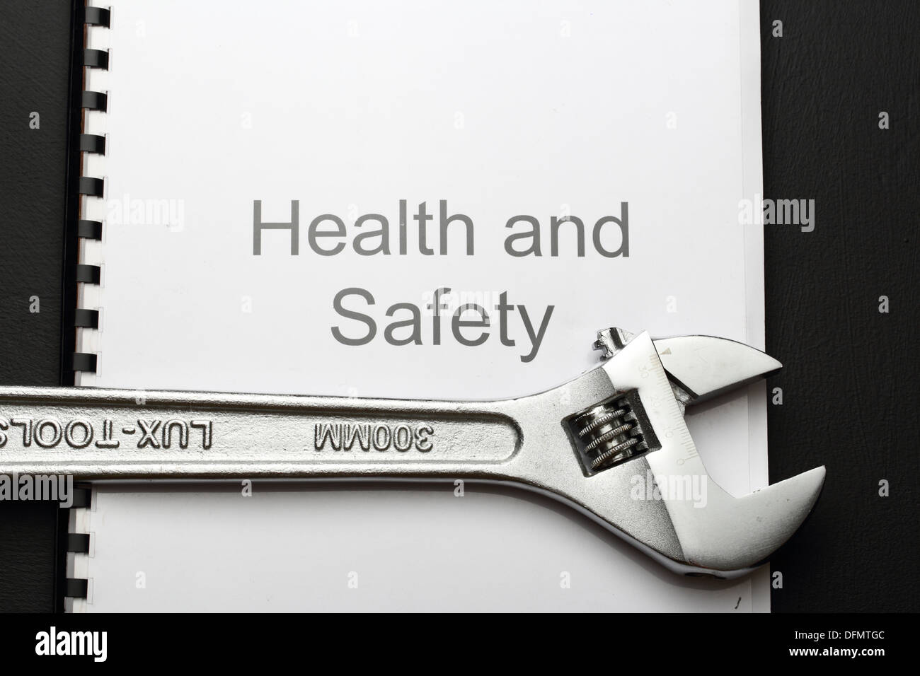 Health and safety register with spanner Stock Photo - Alamy