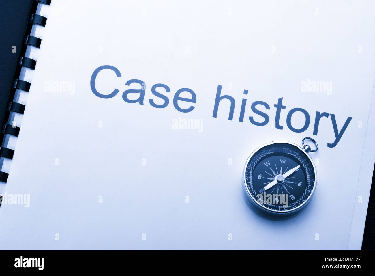 Case history and compass on black Stock Photo - Alamy