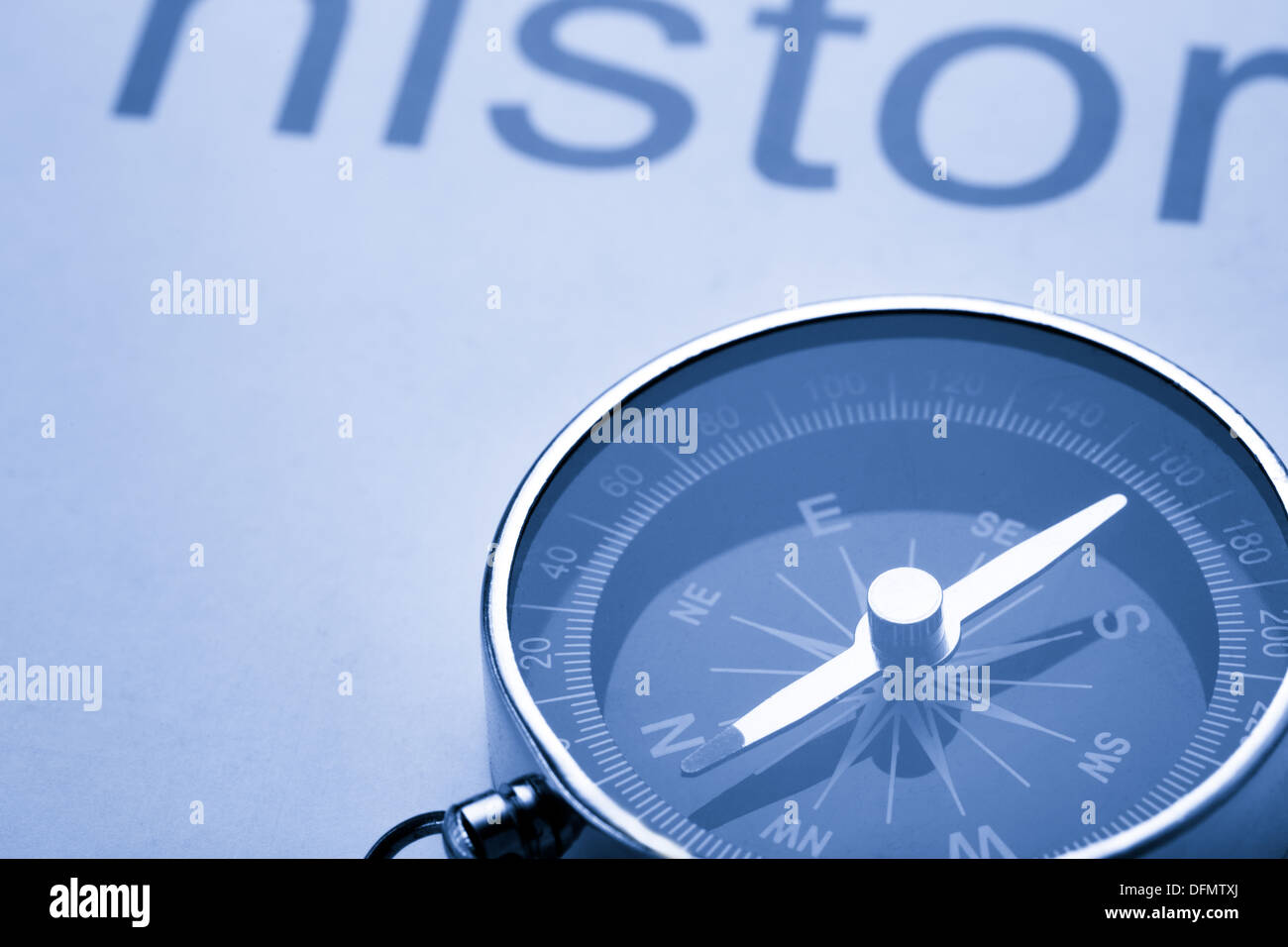 History book and compass on black Stock Photo - Alamy