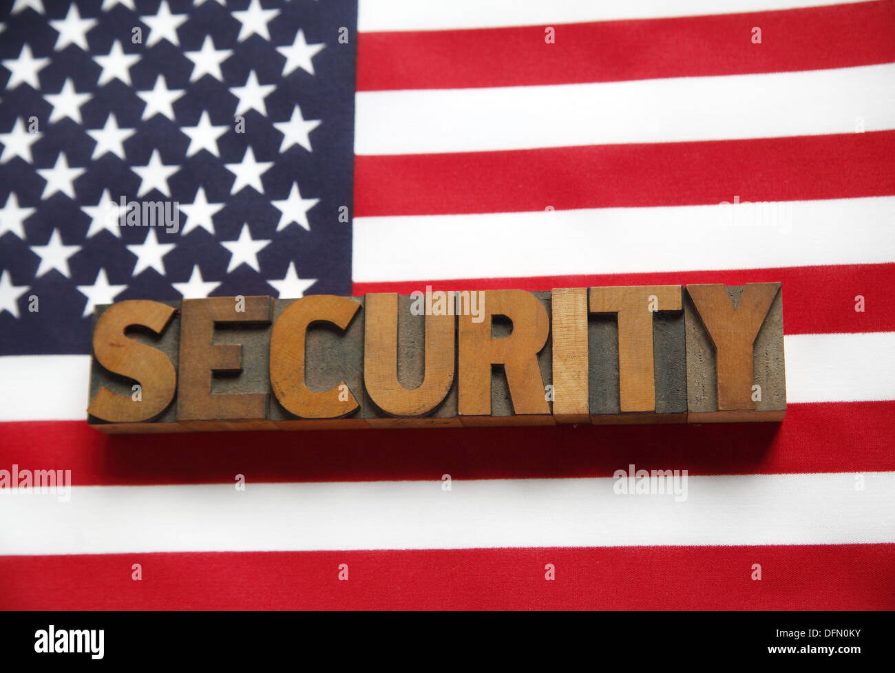 the word 'security' in old wood type on a USA flag Stock Photo - Alamy