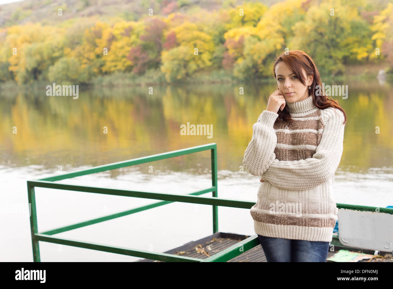 Woman leaning against railings hi-res stock photography and images - Alamy