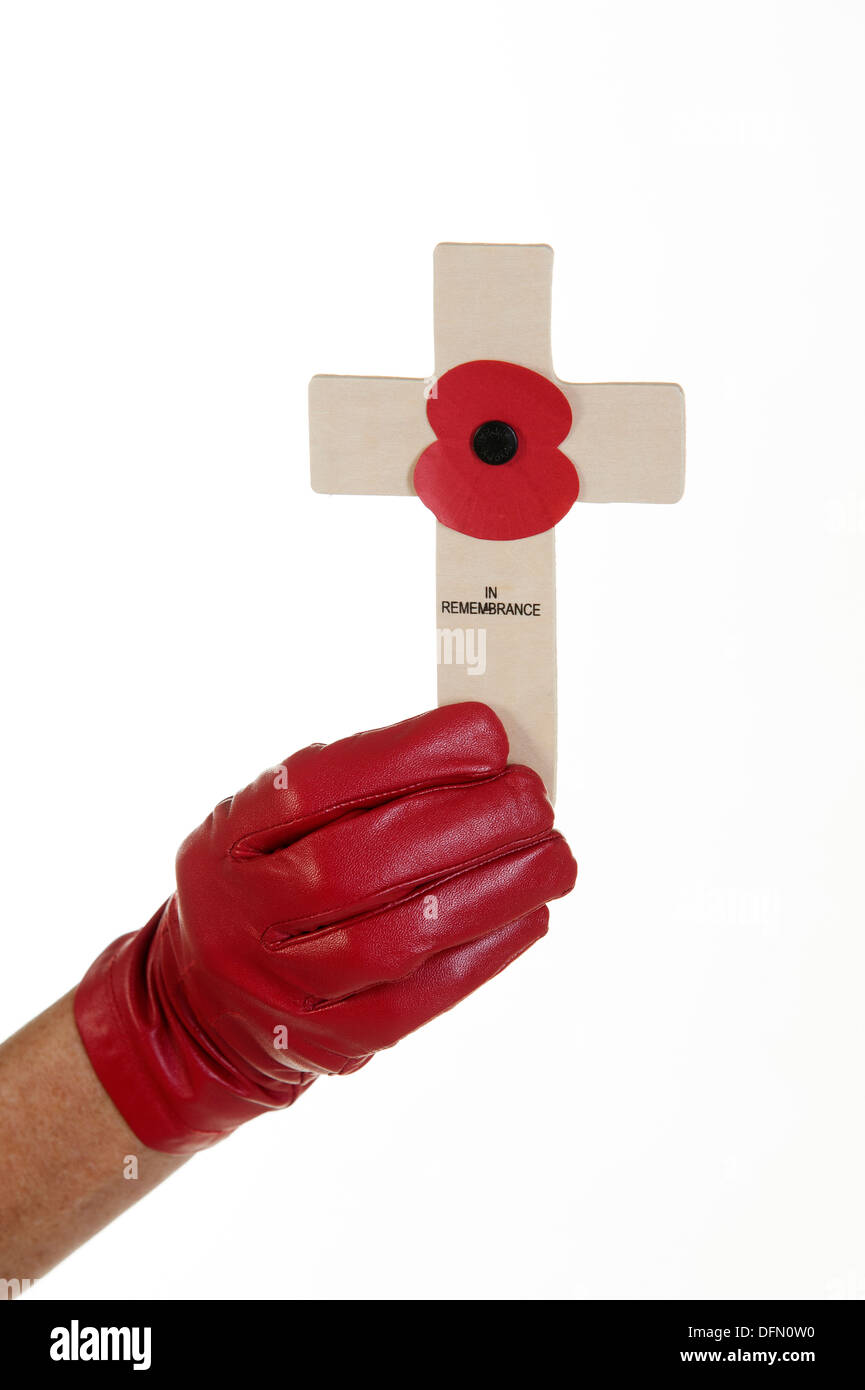 Red glove and Remembrance Day cross with poppy Stock Photo - Alamy