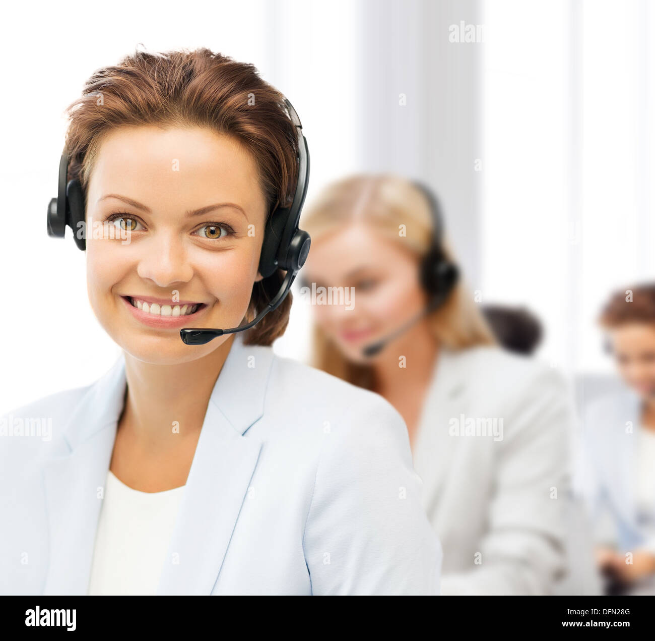 female helpline operator with headphones Stock Photo - Alamy