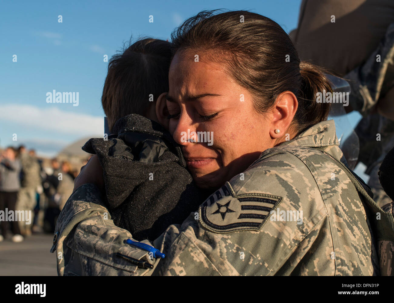 An Air Force staff sergeant hugs her son at the Mountain Home Air Force ...