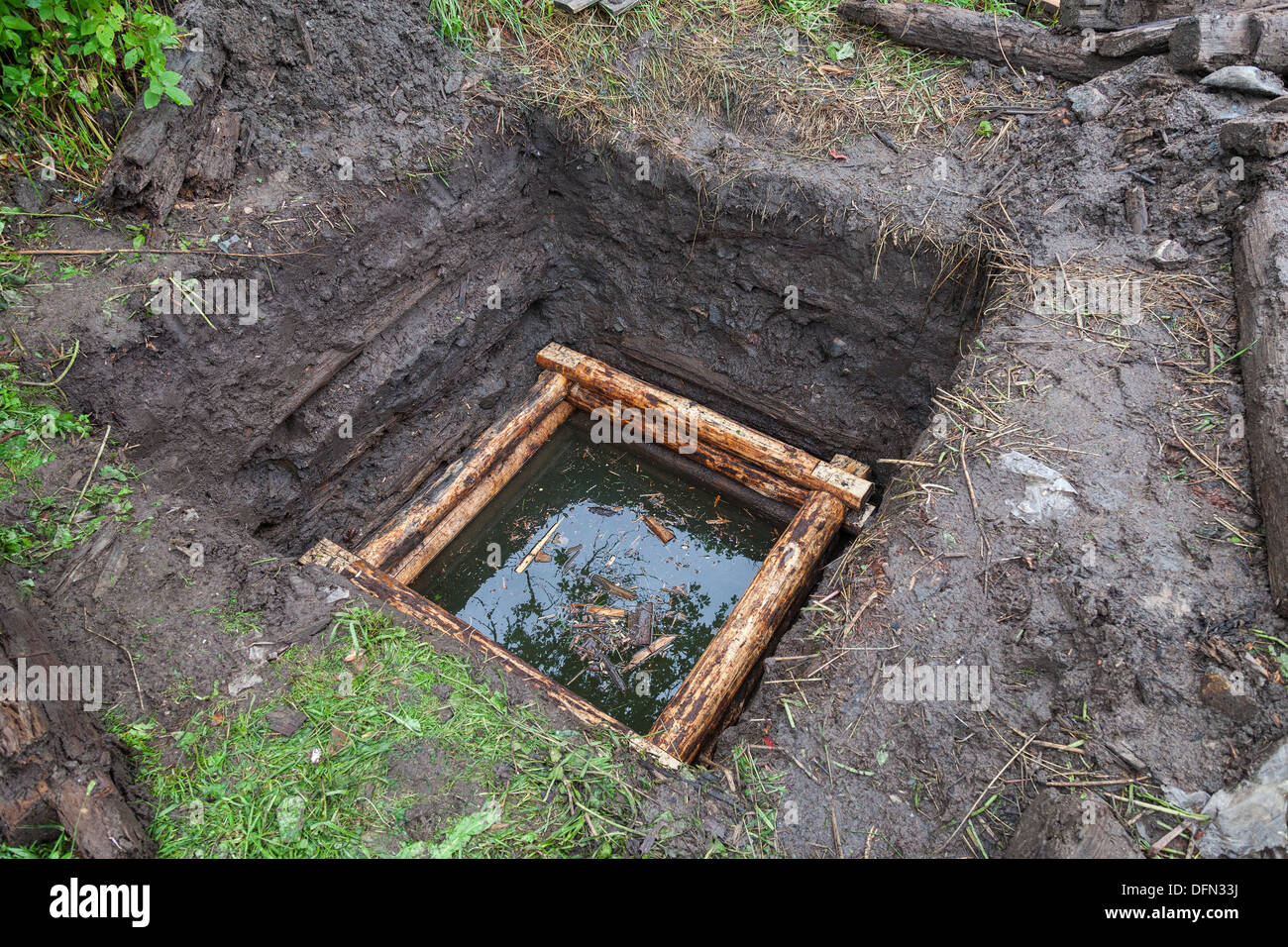 Construction of wooden water well in countryside Stock Photo - Alamy