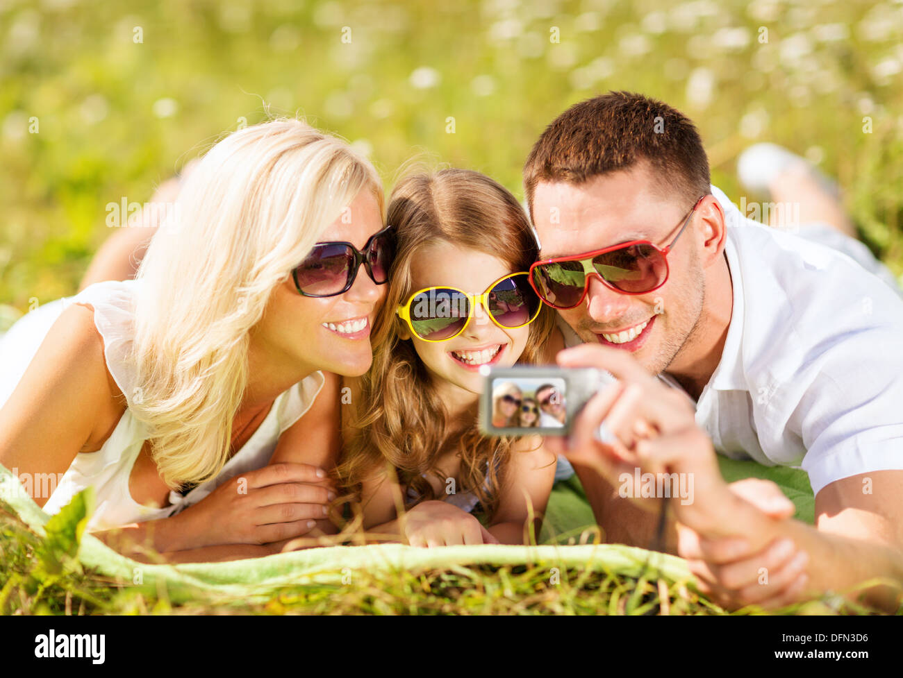 happy family with camera taking picture Stock Photo - Alamy