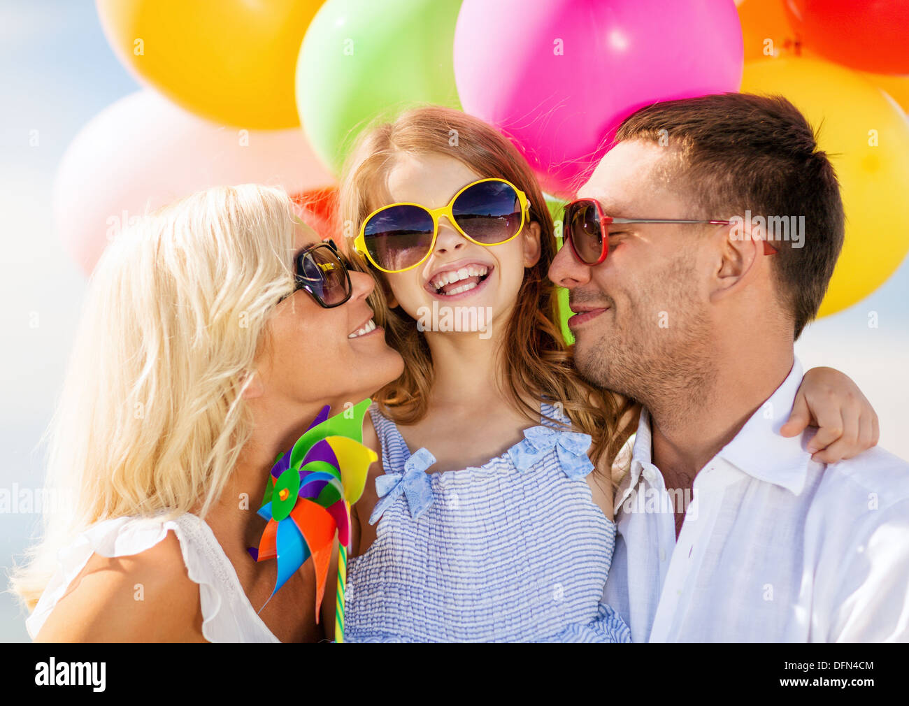 family with colorful balloons Stock Photo - Alamy