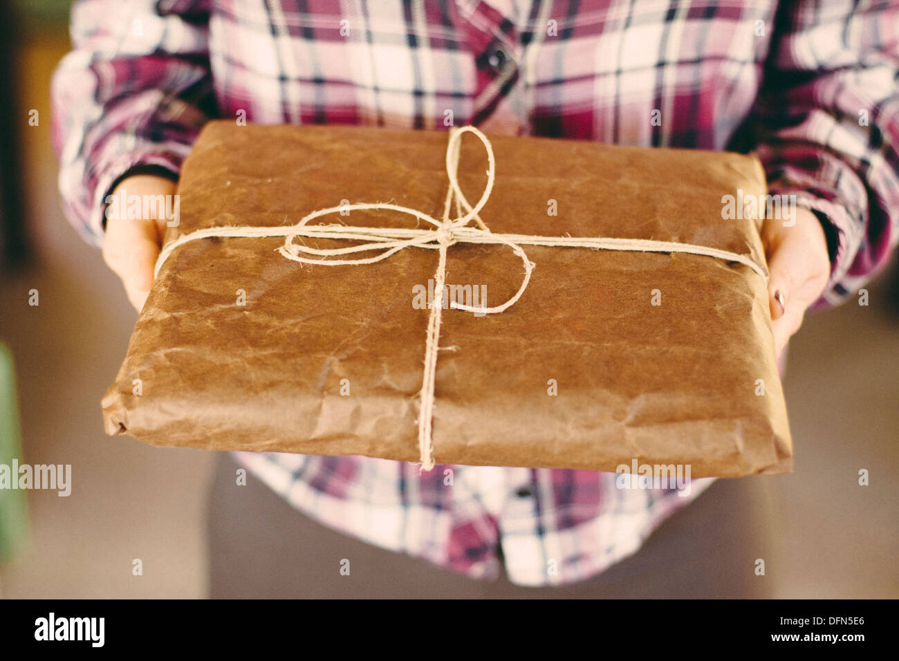 Hand wrapped package Stock Photo - Alamy