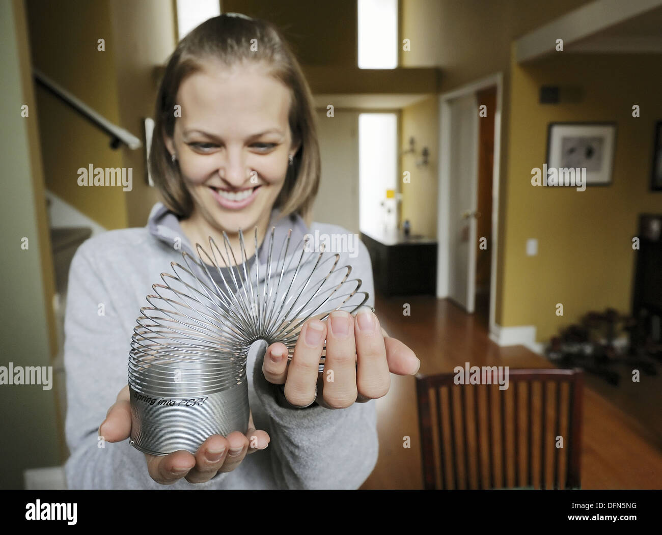 Human Hand Holding Slinky Toy
