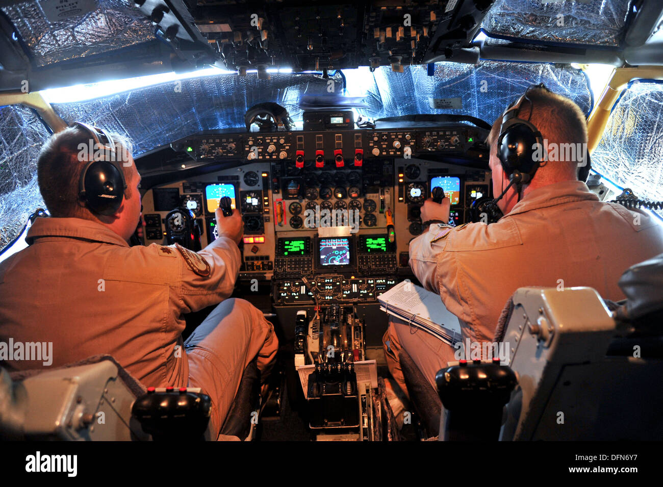 Maj. Jeremy Keyes and 1st Lt. Jacob Kummrow perform pre-flight checks ...