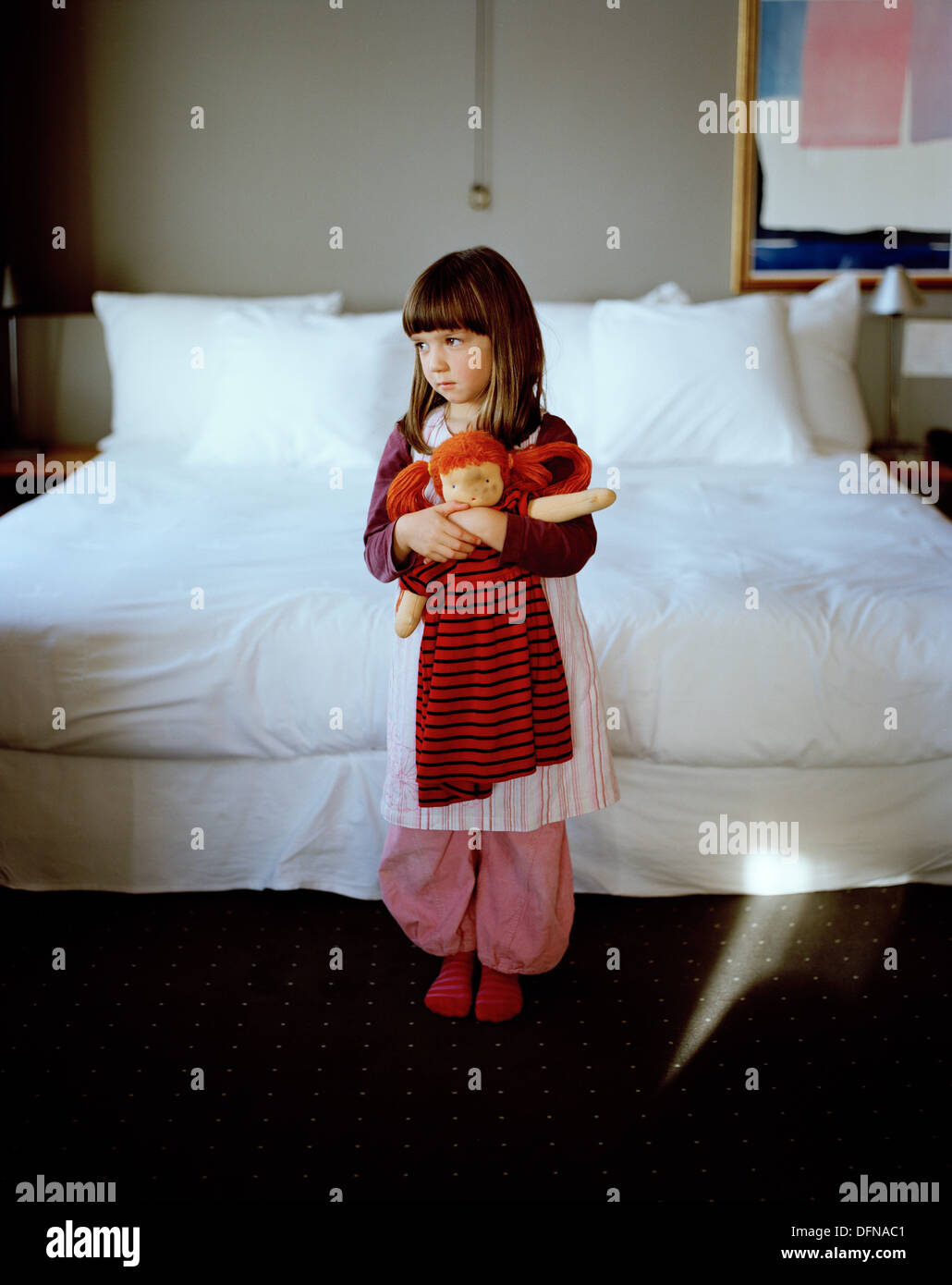Girl with rag doll beside a hotel bed, Rotterdam, Netherlands Stock ...