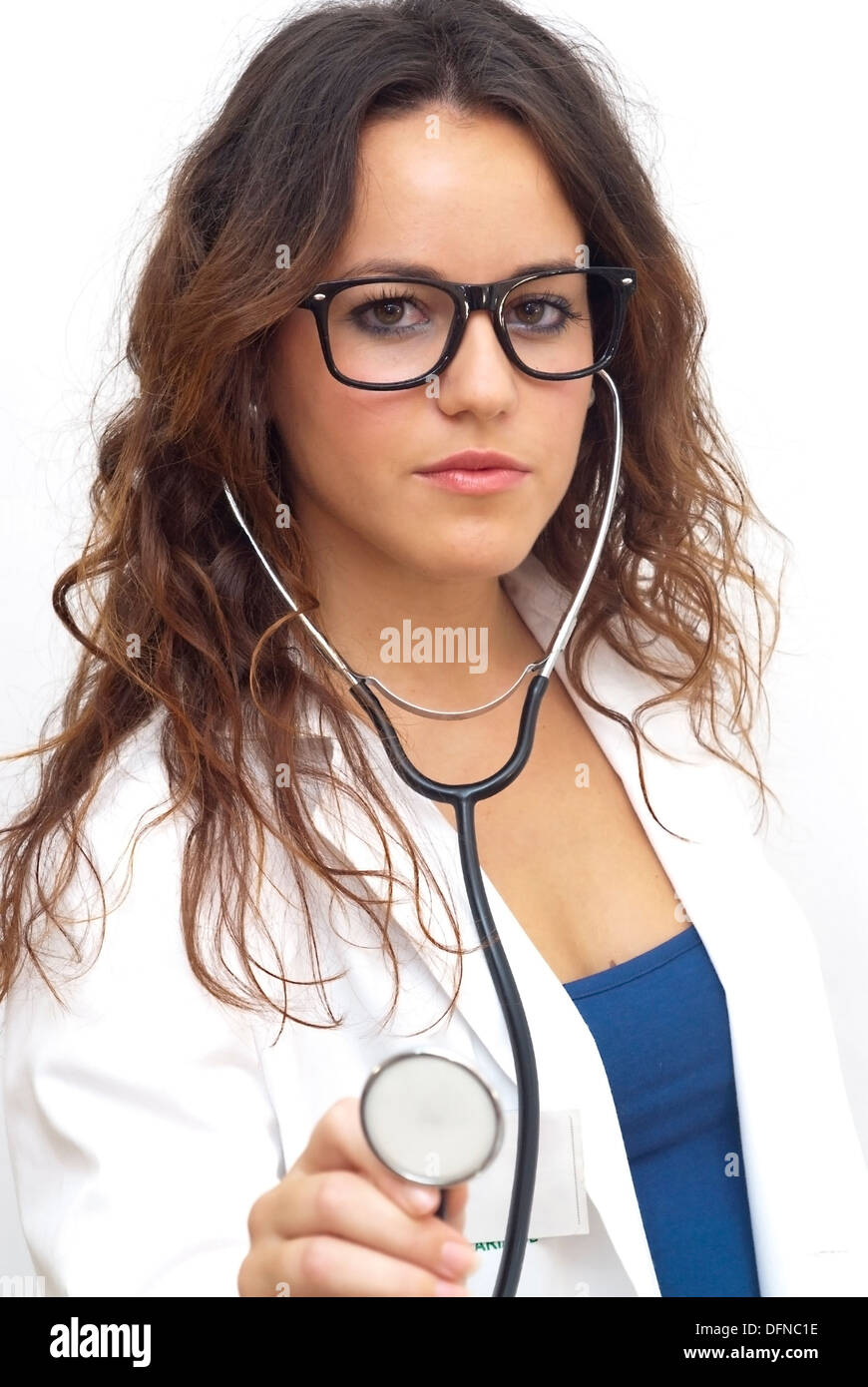 Pretty medical doctor woman with glasses and stethoscope over white ...
