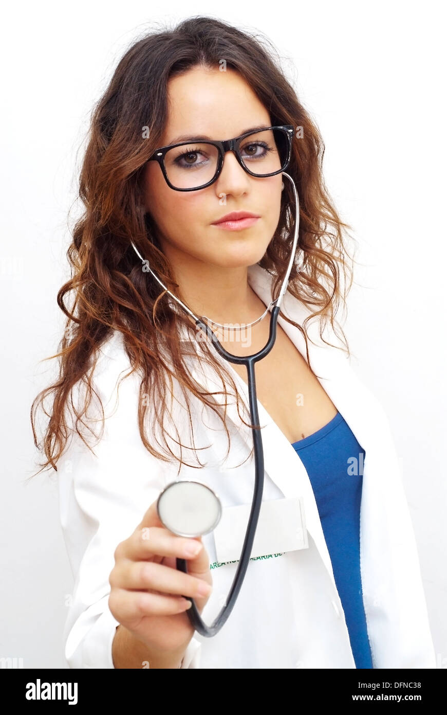 Pretty medical doctor woman with glasses and stethoscope over white ...